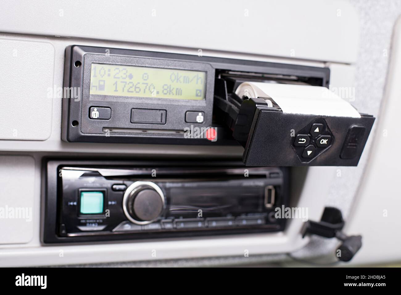 Digital tachograph with open printer and visible roll of paper. Car ...