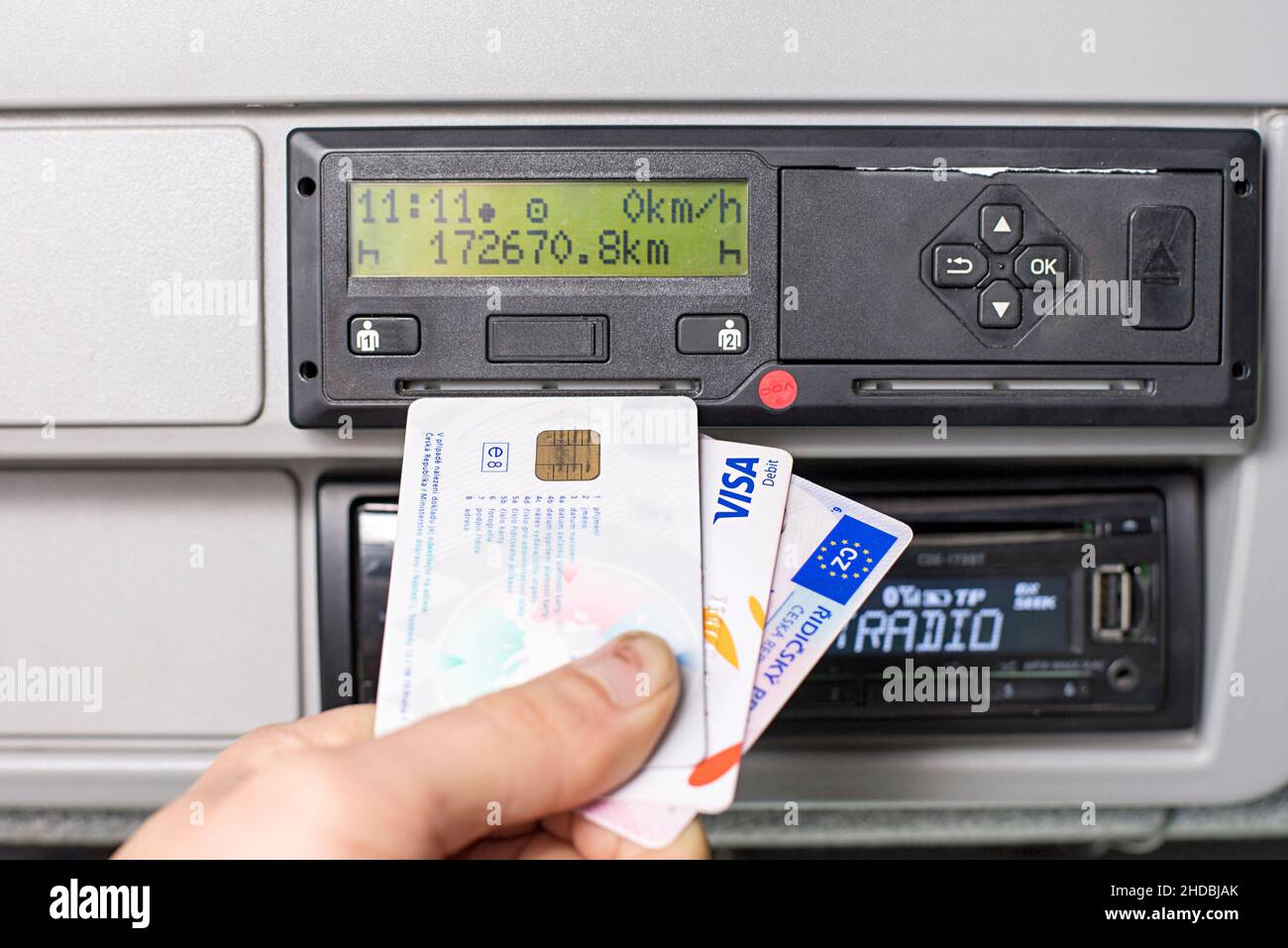 Hand holding a driver digital card, bank debit card and and Europian ...