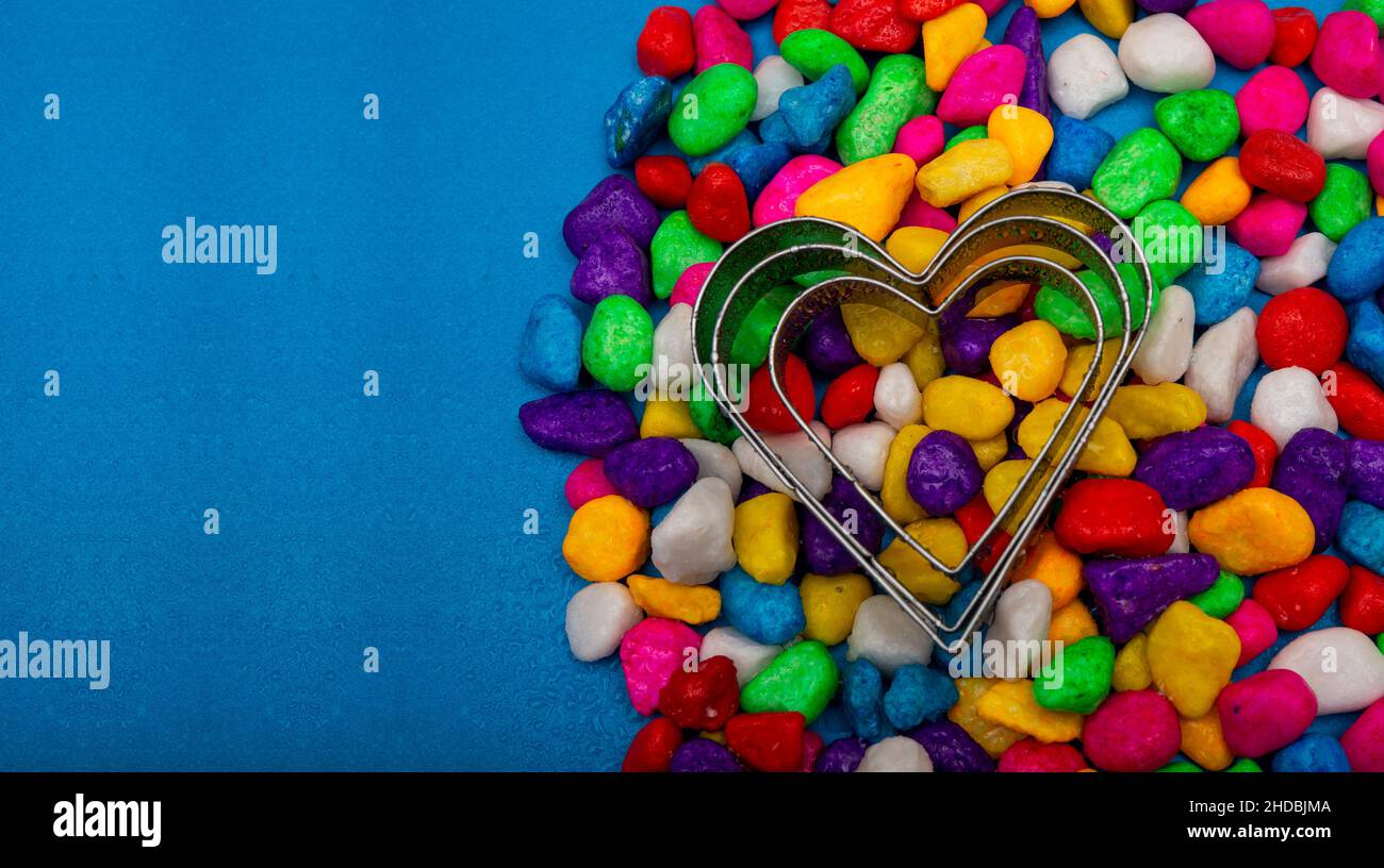 Multiple heart shapes on different color stones - diversity concept ...