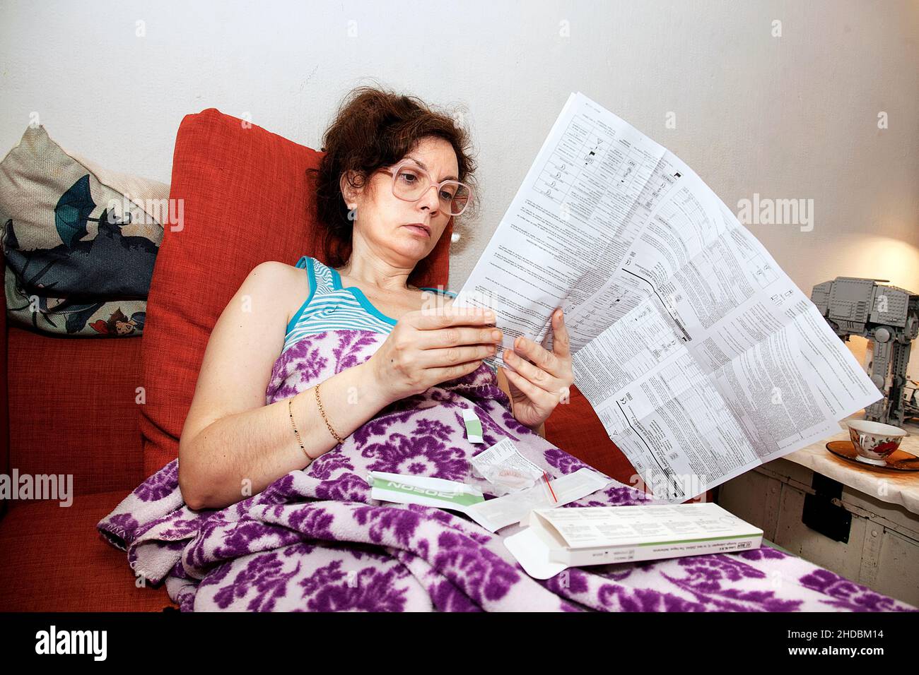 Woman reading the instructions for a lateral flow test, Barcelona ...