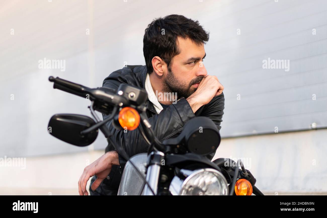 Young man on a motor bike hi-res stock photography and images - Alamy