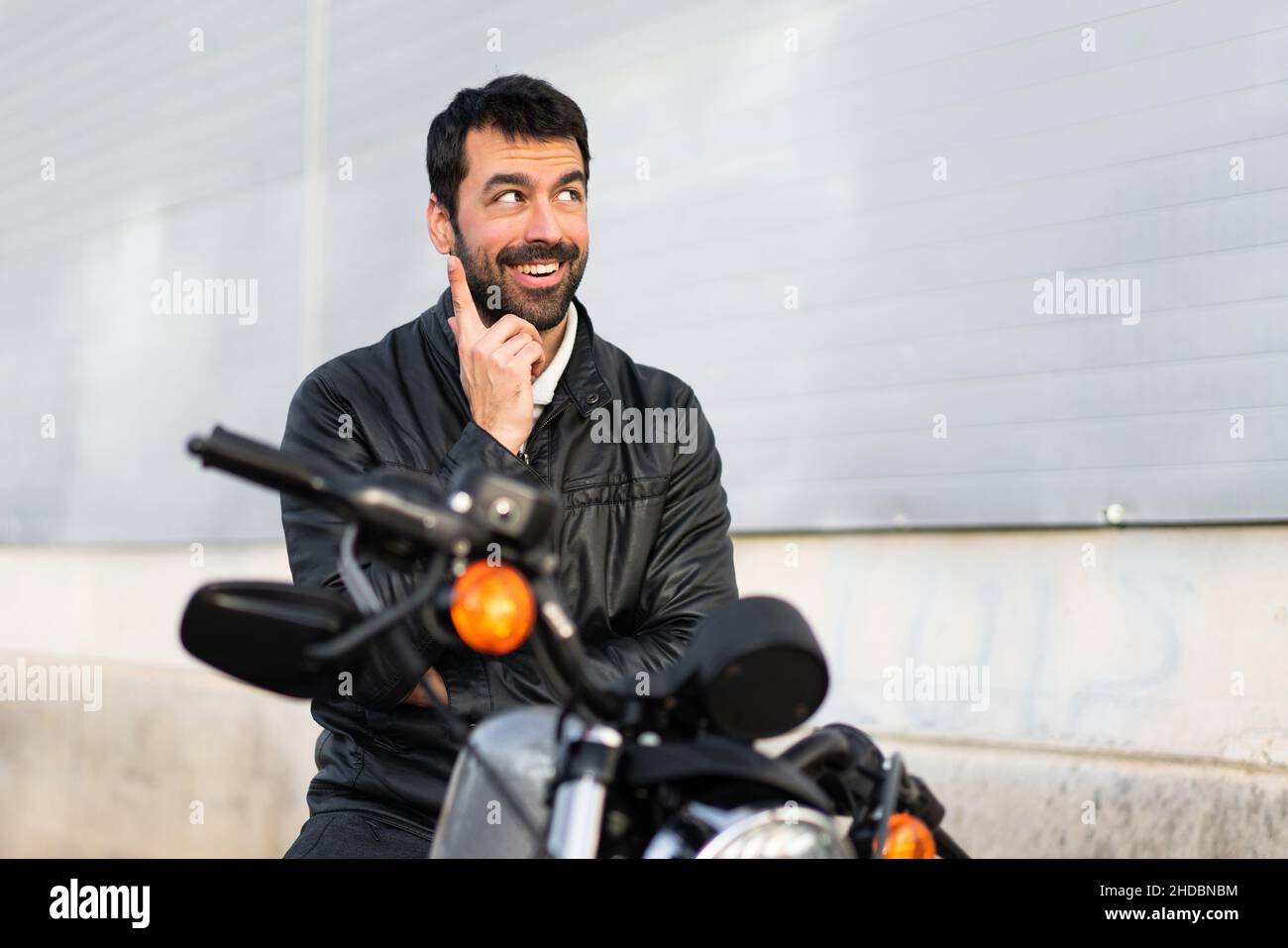Thinking biker hi-res stock photography and images - Alamy