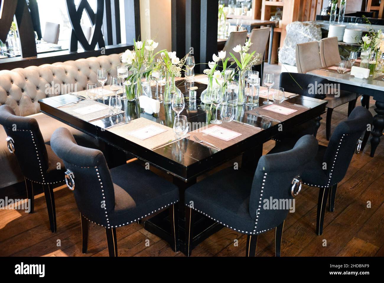 Elegant table set up inside a restaurant Stock Photo - Alamy