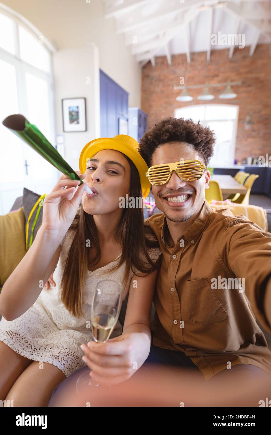 Happy Man Taking Selfie With Girlfriend Blowing Party Horn Celebrating