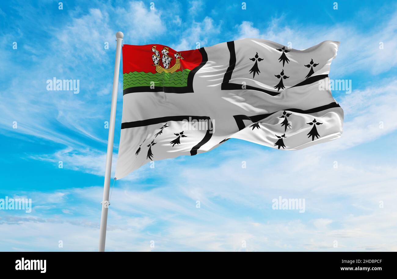 flag of department of Nantes, France at cloudy sky background on sunset ...