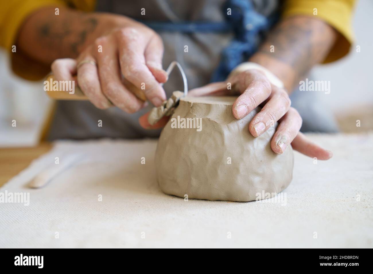 Ceramics creation process: female artist shaping and sculpting clay ...