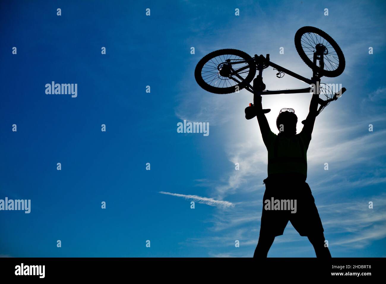 The cyclist raised the bike above him celebrating the victory against ...