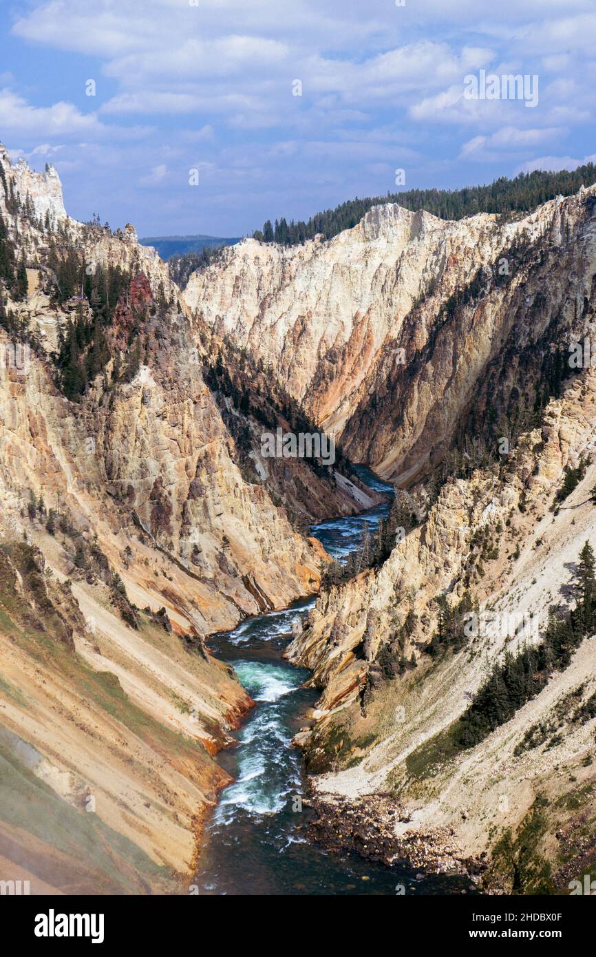 Vertical shot of the river flowing between rocks. Yellowstone National ...