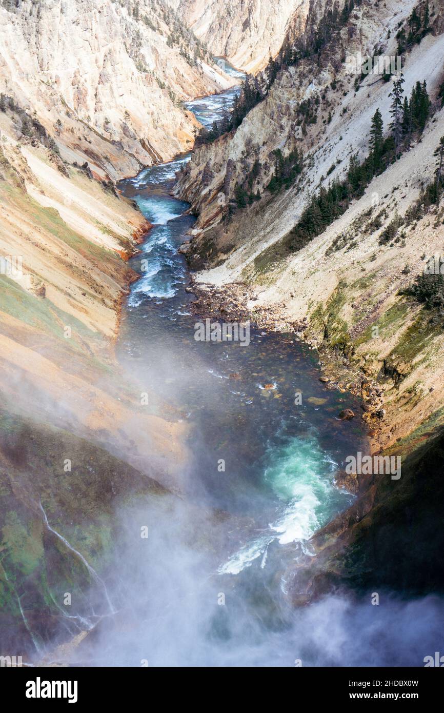 Vertical shot of the river flowing between rocks. Yellowstone National ...