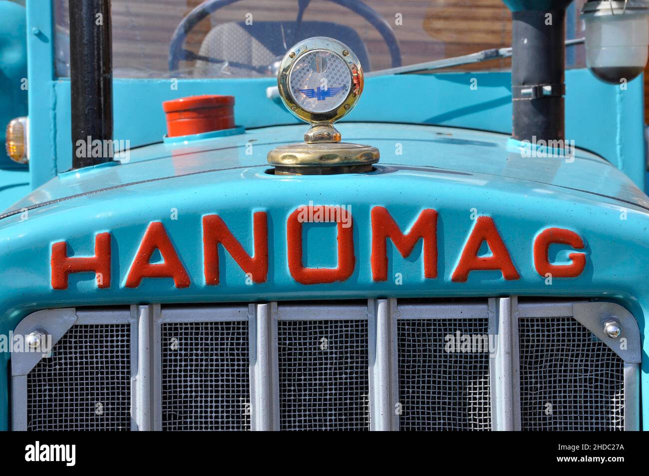 Hanomag logo with radiator figure on turquoise metal from tractor Stock ...