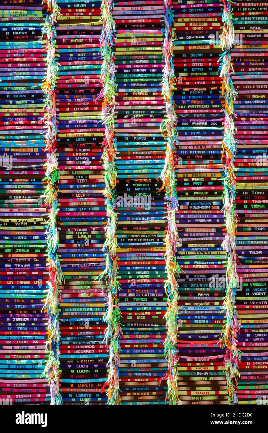 Friendship ribbon with name at market stall, Villaricos, Andalusia ...