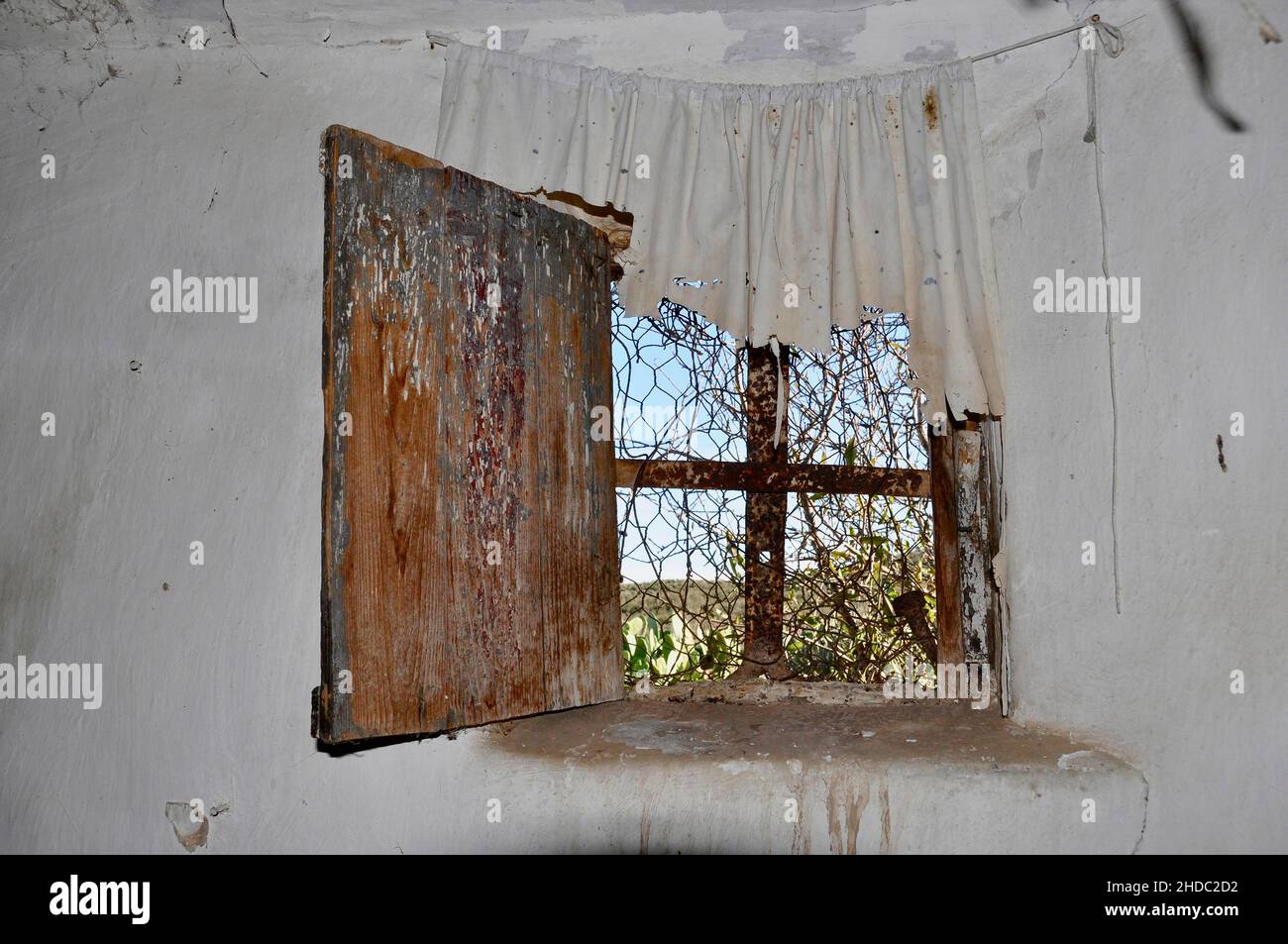 Window with broken plastic curtain in abandoned house Stock Photo - Alamy