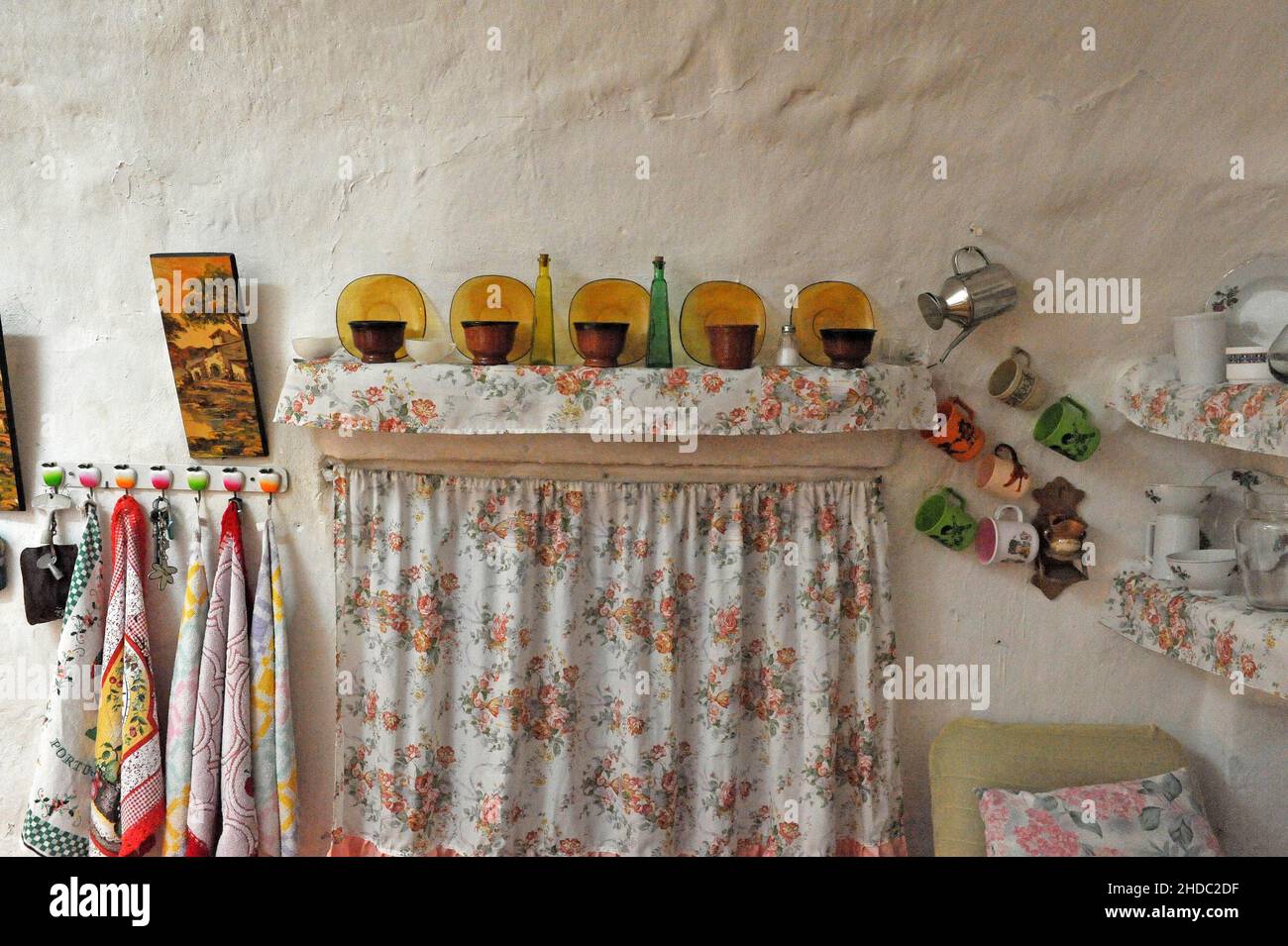 Curtain with decoration of objects from kitchen of cave house ...