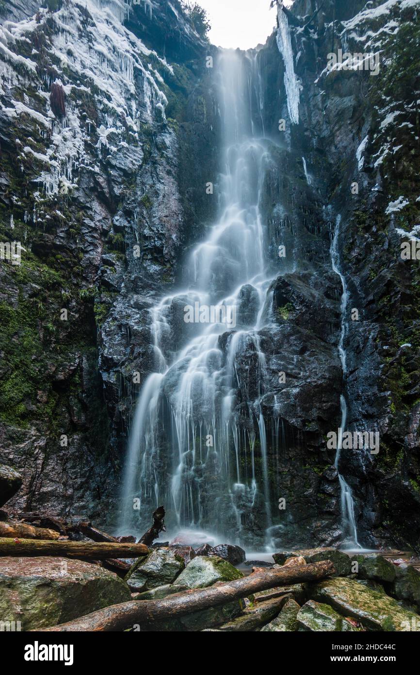 The Burgbach waterfall in the middle of the green forest. Waterfall in ...