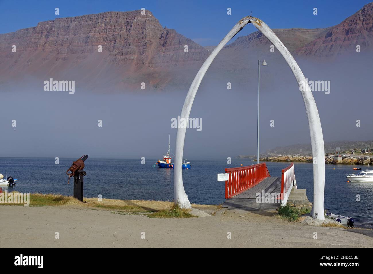 Cloud wall, red volcanic rock, whalebone gate, Disko Island, Disko Bay ...