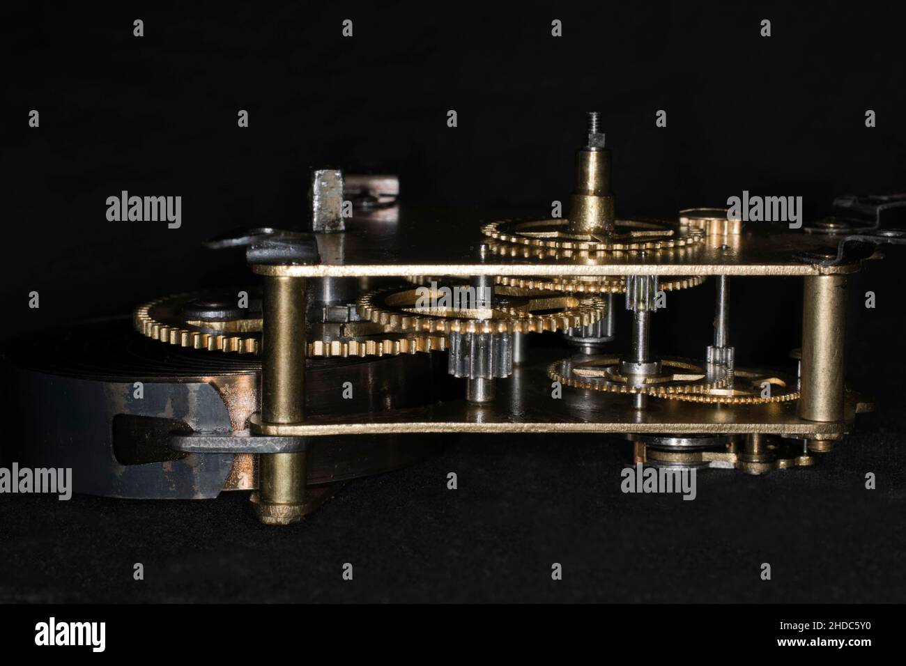Gears of an old clockwork, studio photography with black background ...