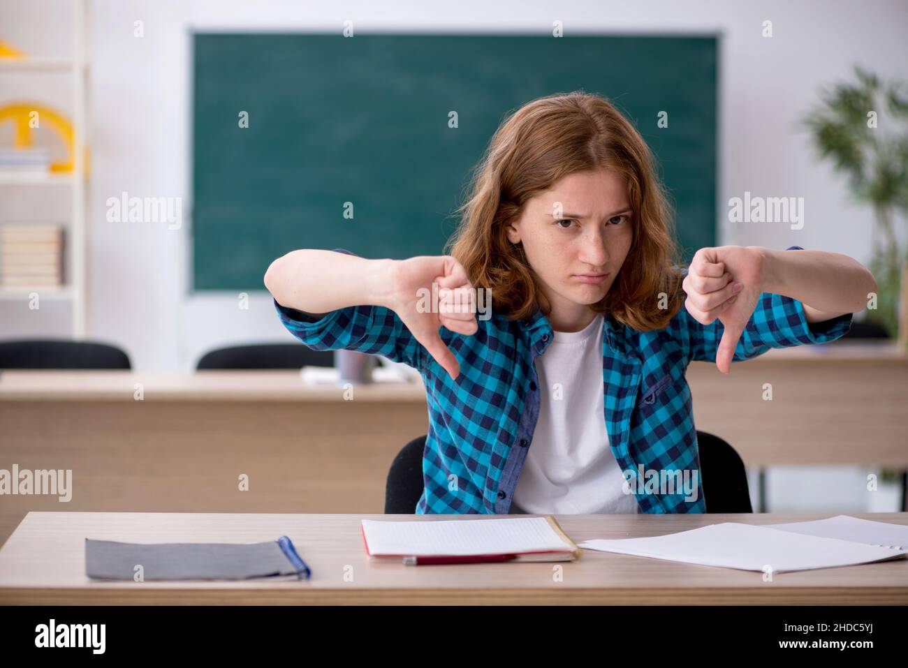 Female student preparing for exams in the classroom Stock Photo - Alamy
