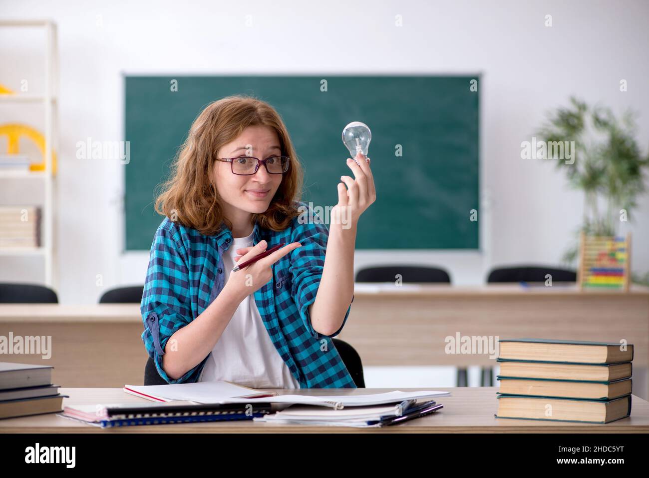 Female student in happy idea concept Stock Photo - Alamy