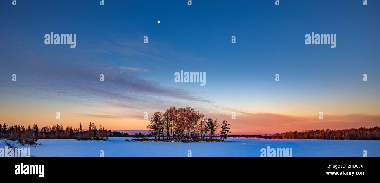 The moon setting on the Chippewa Flowage in northern Wisconsin Stock ...