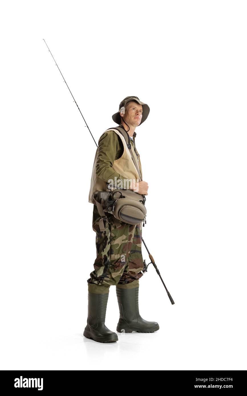 Portrait of young man, professional fishman with fishing rod, spinning ...