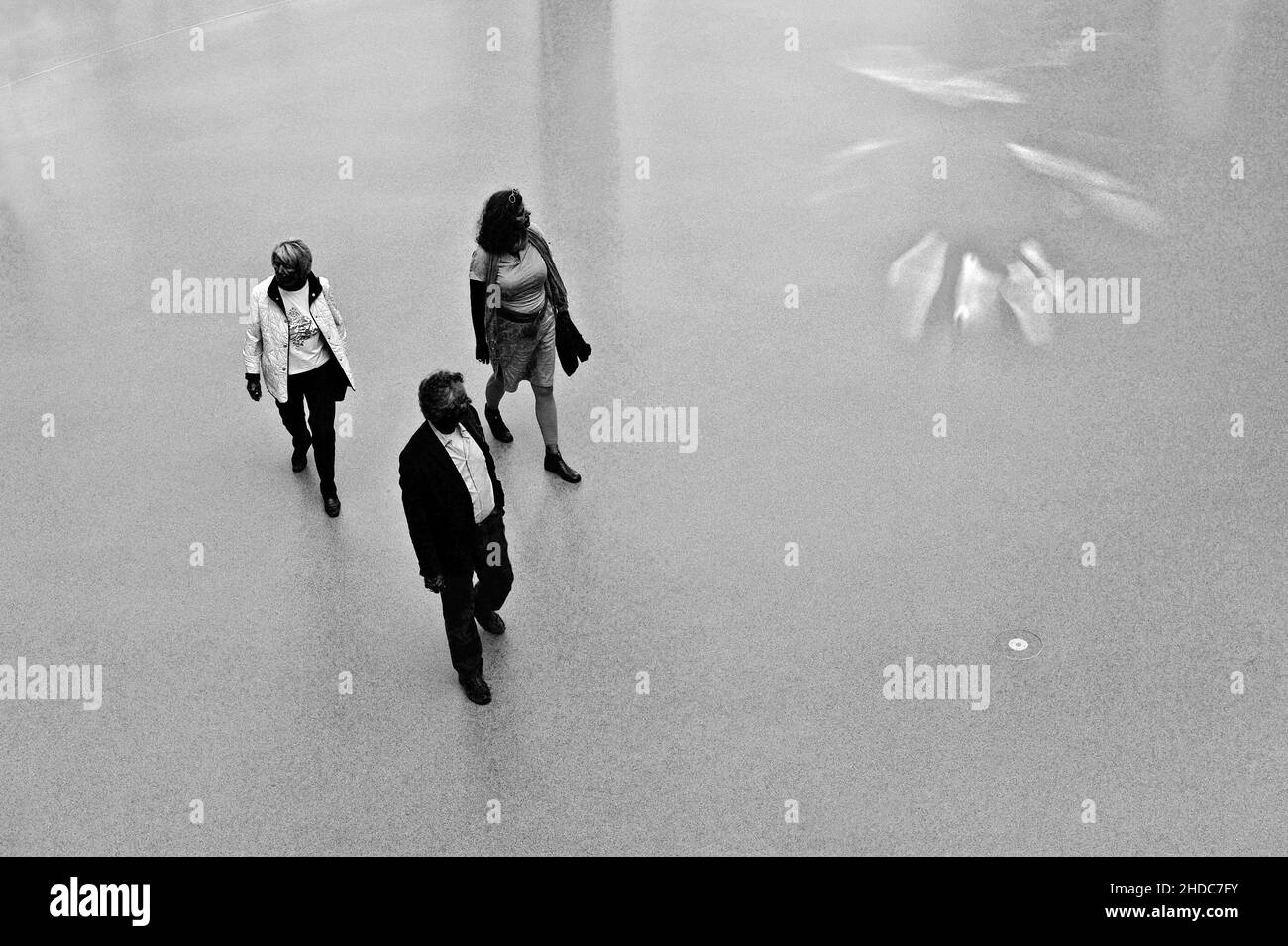 People from above on smooth, reflecting ground, top view Stock Photo ...