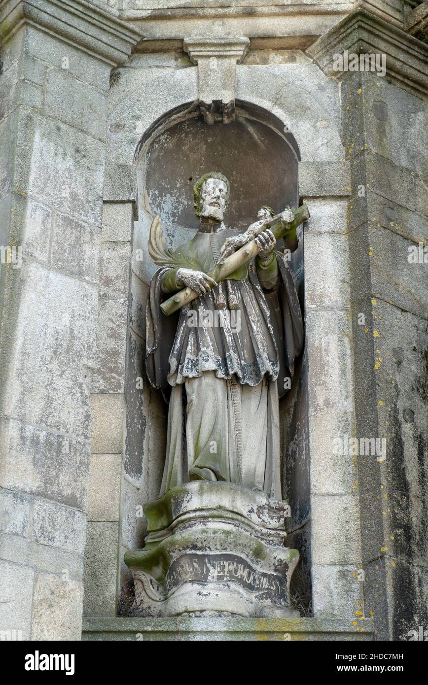 Shot of a religious statue of a man carrying a Christ with Jesus Stock ...