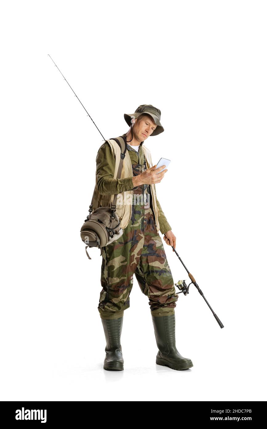 Portrait of young man, professional fishman with fishing rod, spinning ...