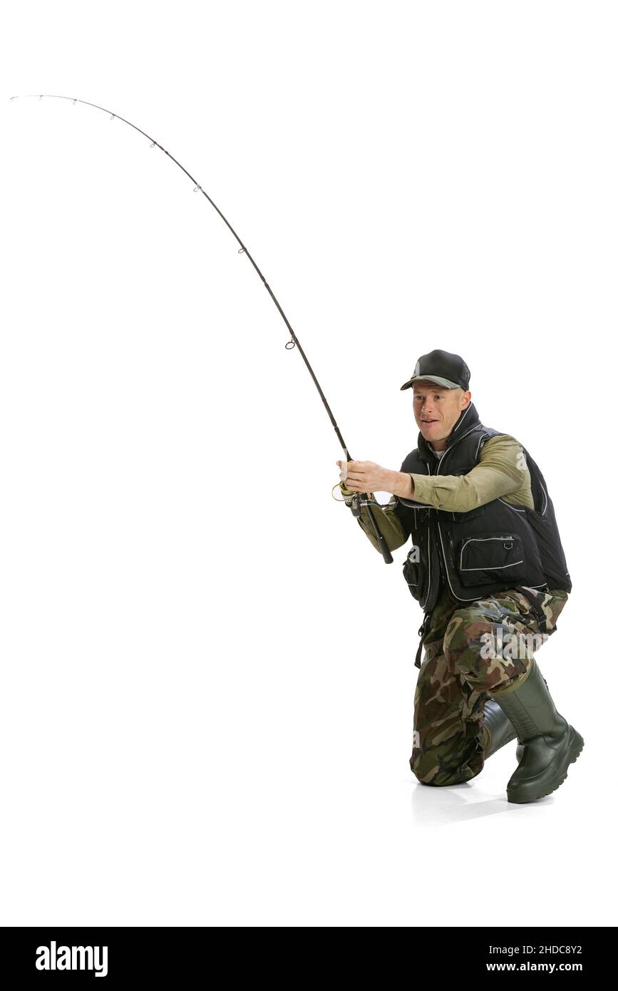 Portrait of young man, professional fisherman with fishing rod ...