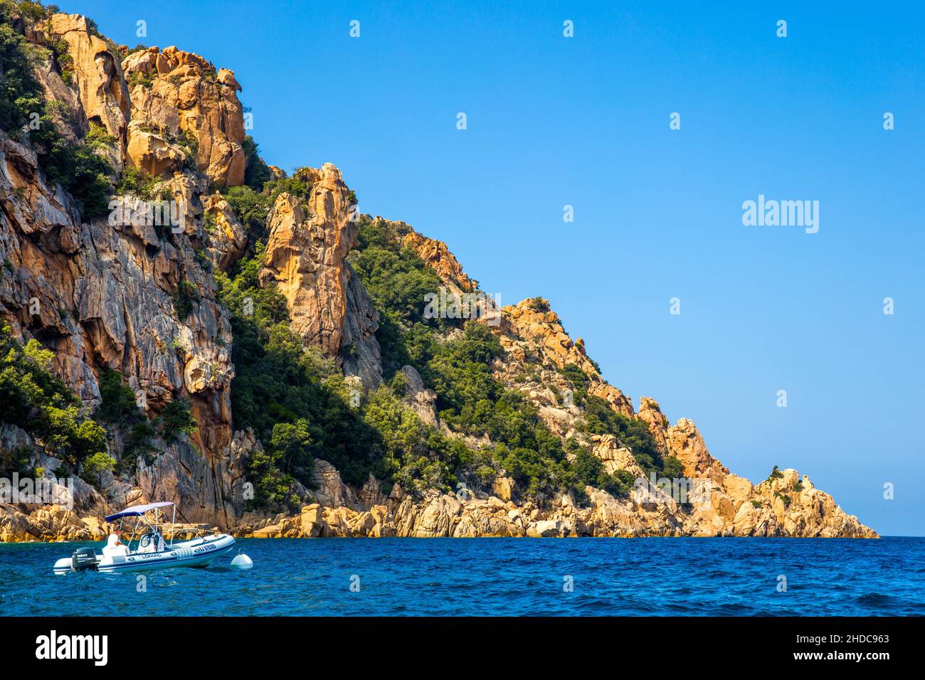 Rock formations and deep blue water in the Scandola nature reserve ...