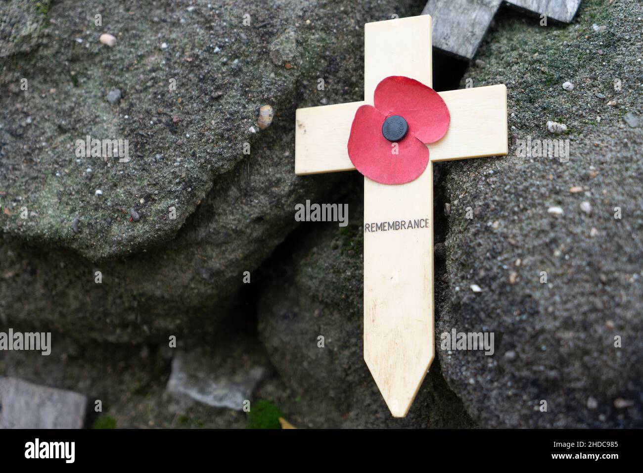 Lest we forget - Remembrance poppy on a wooden cross symbol of the ...