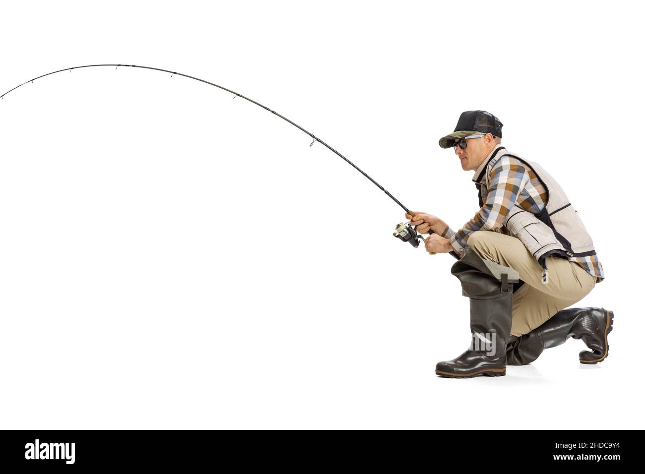 Portrait of young man, professional fisherman with fishing rod ...
