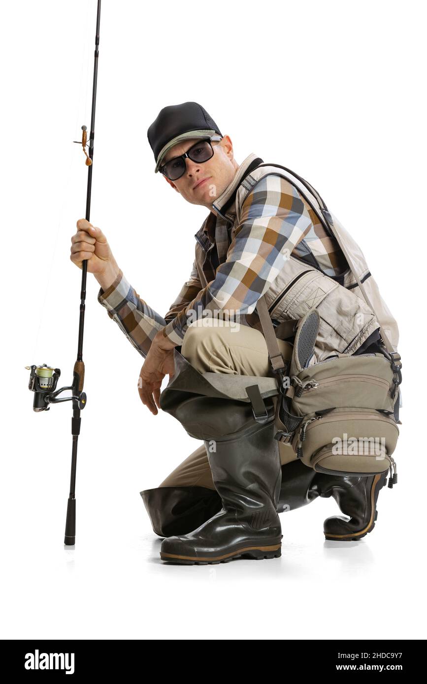 Portrait of young man, professional fisherman with fishing rod ...