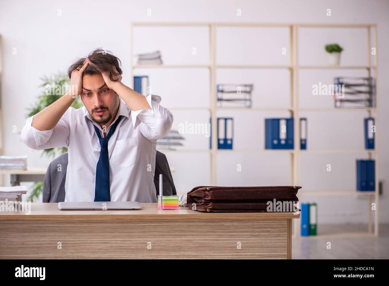 Male alcohol addicted employee sitting in the office Stock Photo - Alamy