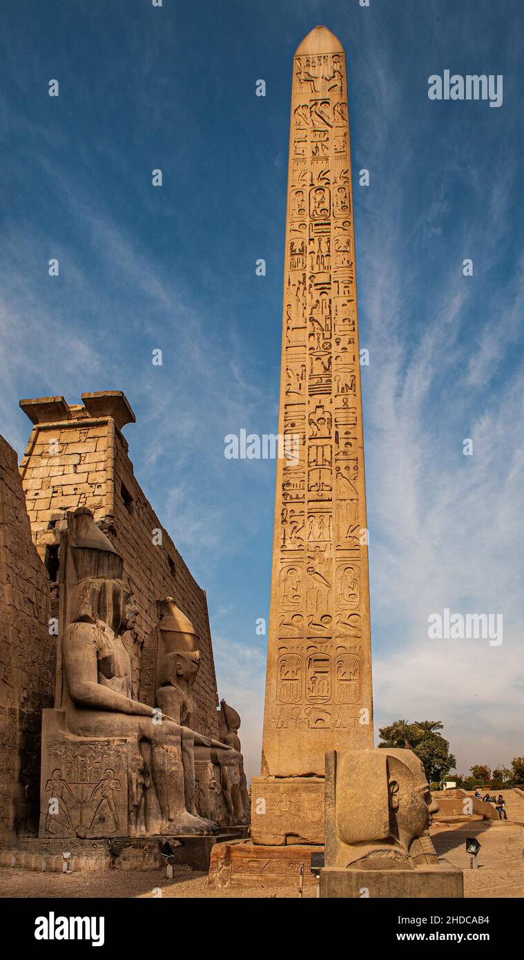 Entrance pylon flanked by two colossal statues of Ramses and obelisk ...
