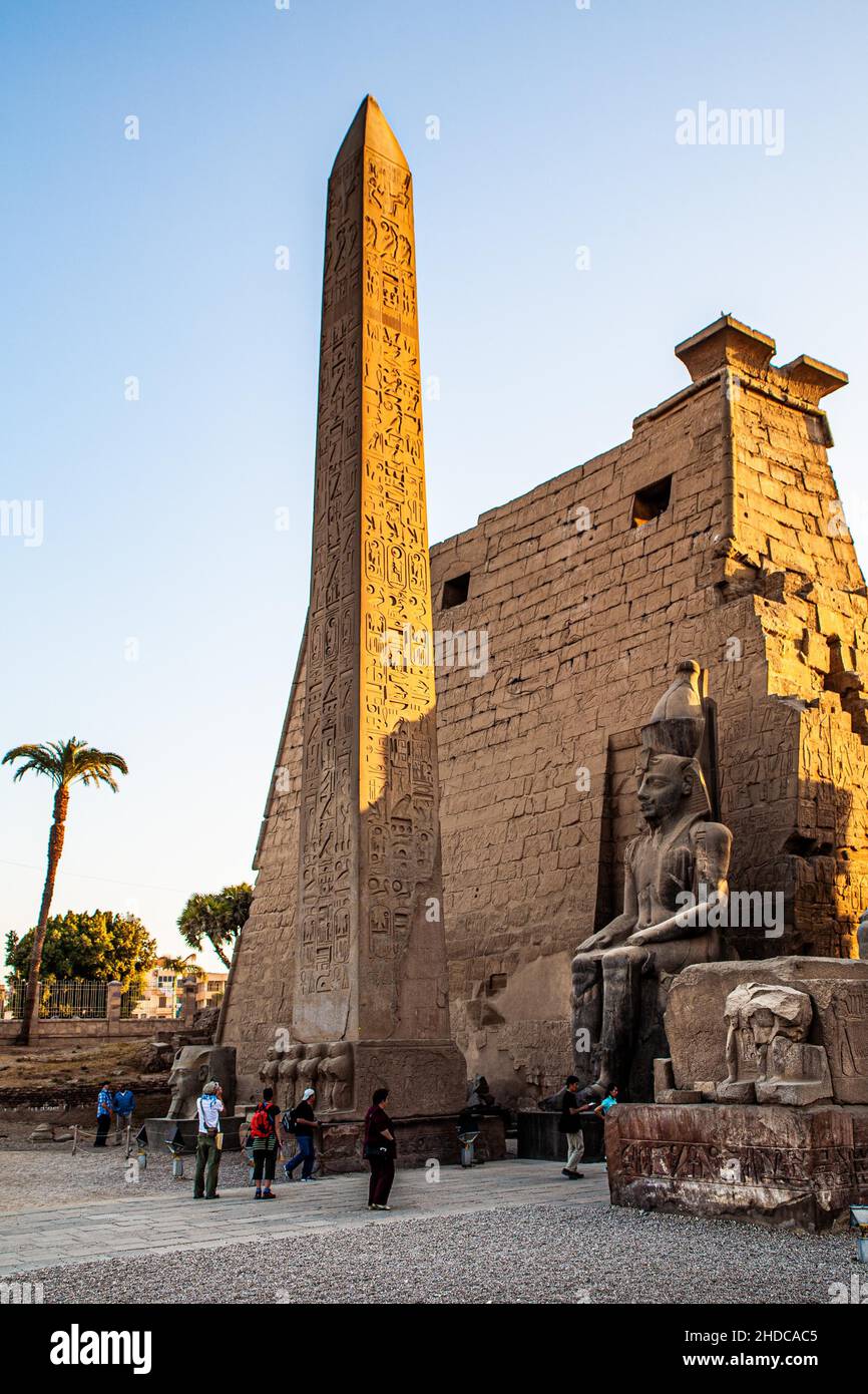 Entrance pylon flanked by two colossal statues of Ramses and obelisk ...
