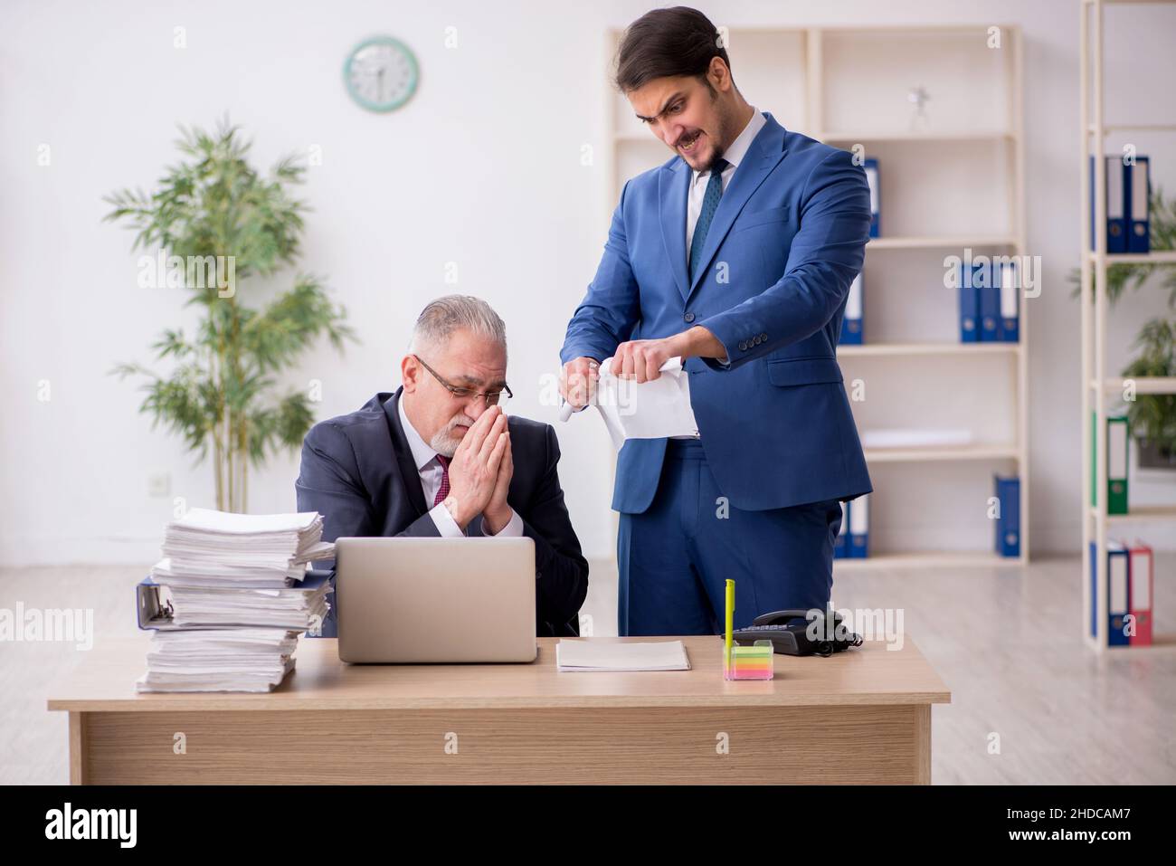 Two employees in dismissal concept Stock Photo - Alamy