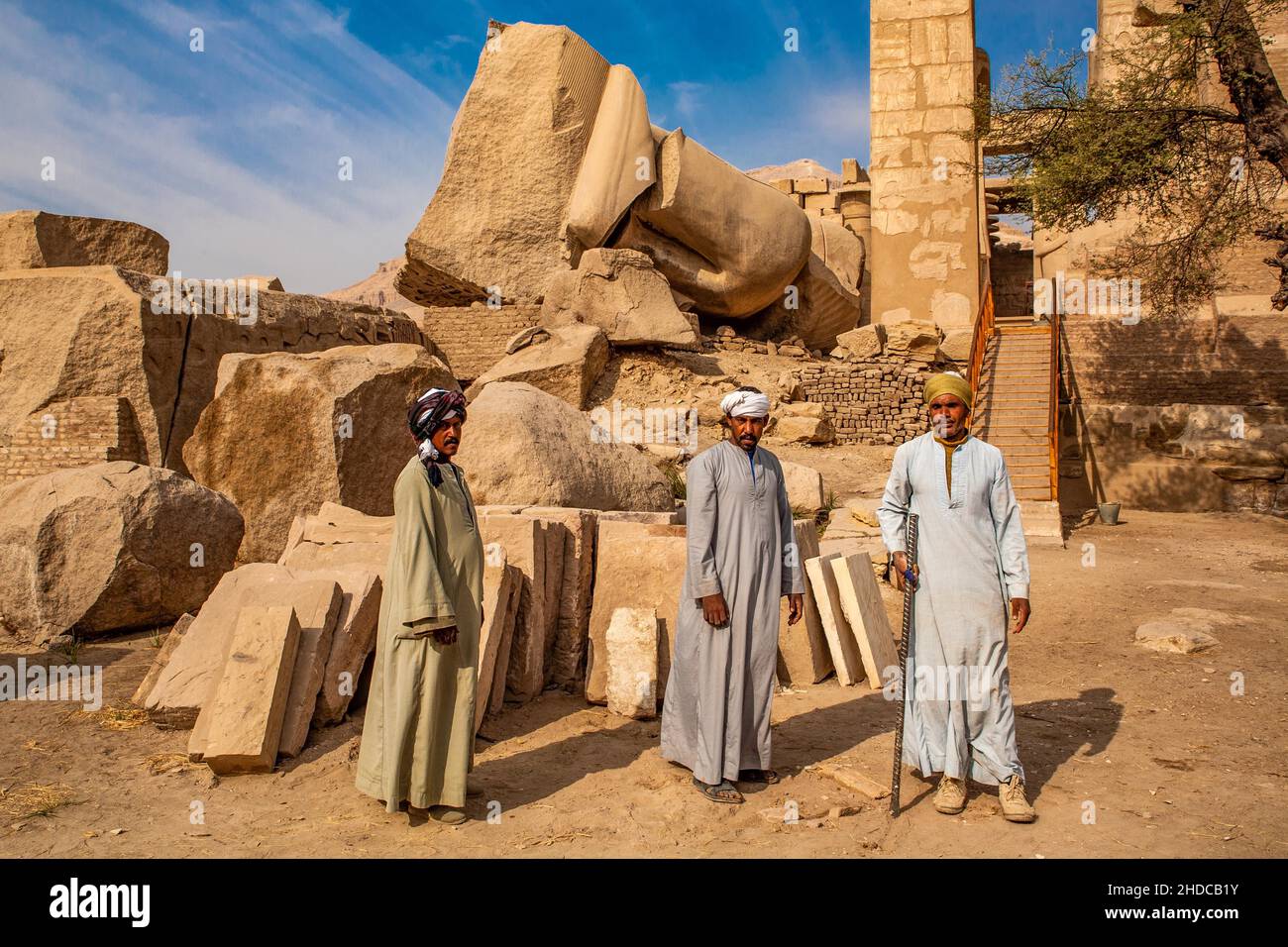 Workers in front of toppled colossus, Ramesseum, mortuary temple of ...