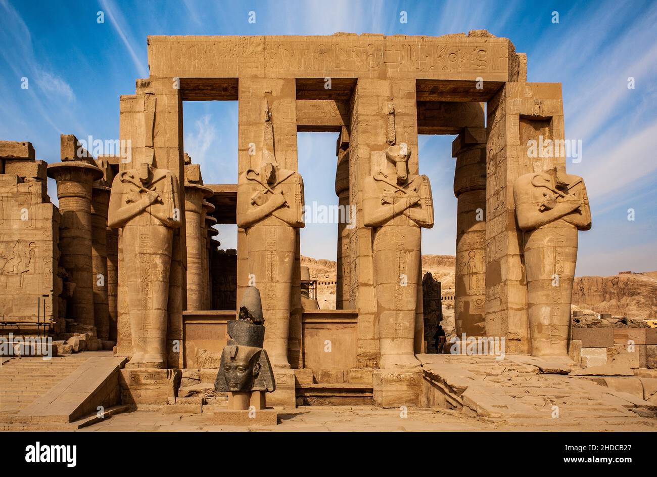 2nd courtyard with statues of Osiris, in front head of a statue of ...