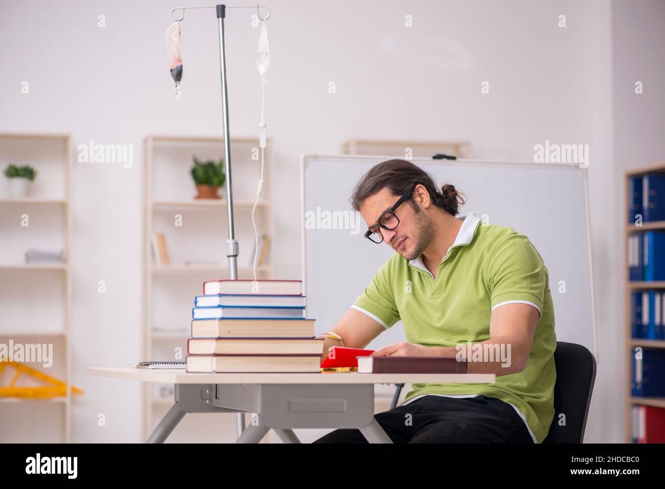 Young sick teacher student in blood transfusion concept Stock Photo - Alamy