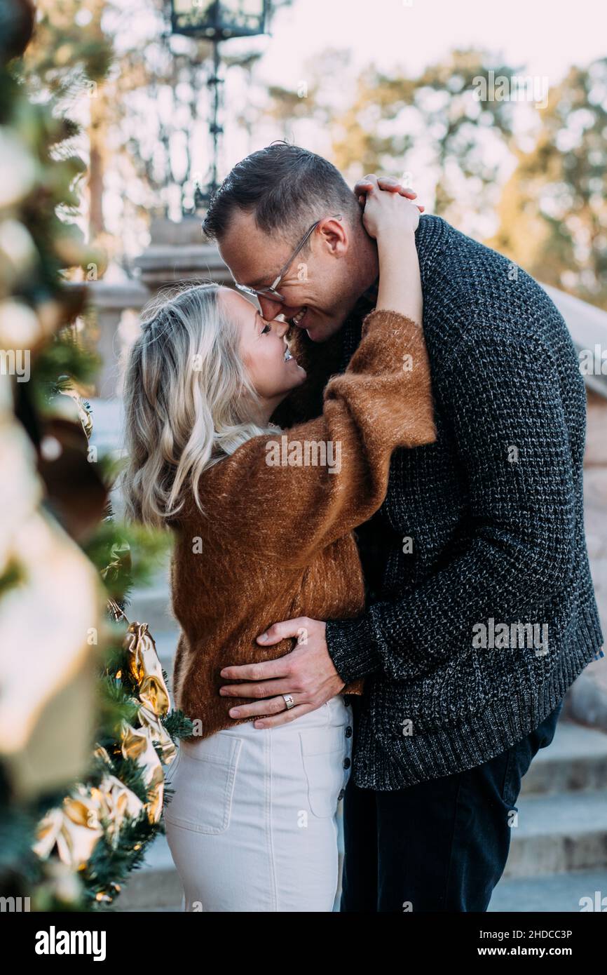 Happy husband and wife hugging and smiling Stock Photo - Alamy