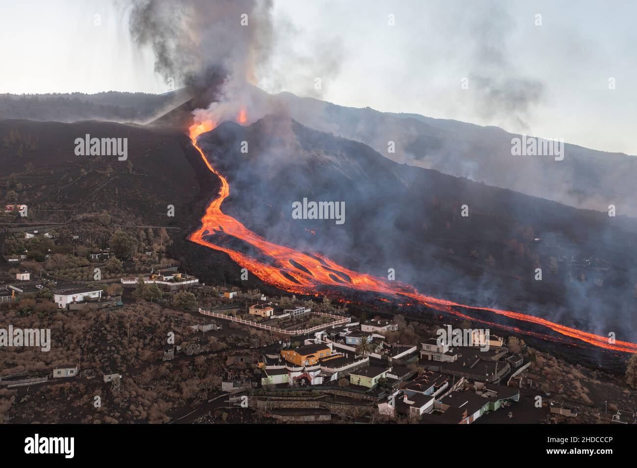 volcano in its first moments of eruption near town Stock Photo - Alamy
