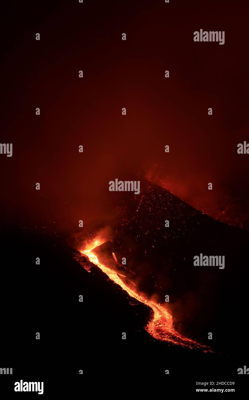 LAVA DESCENDING BY VOLCANO SLIDE AT NIGHT Stock Photo - Alamy