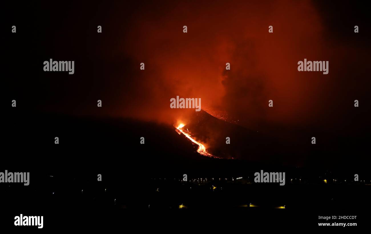 LAVA DESCENDING BY VOLCANO SLIDE AT NIGHT Stock Photo - Alamy