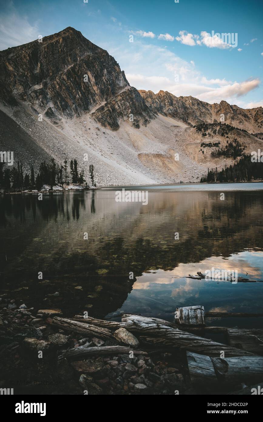 Alpine lake reflection with mountain in background Stock Photo - Alamy