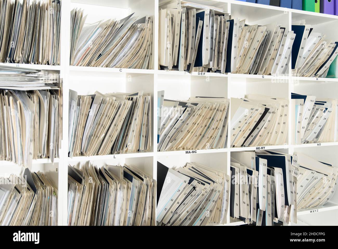Shelves are full with folders and files of medical record, patient ...