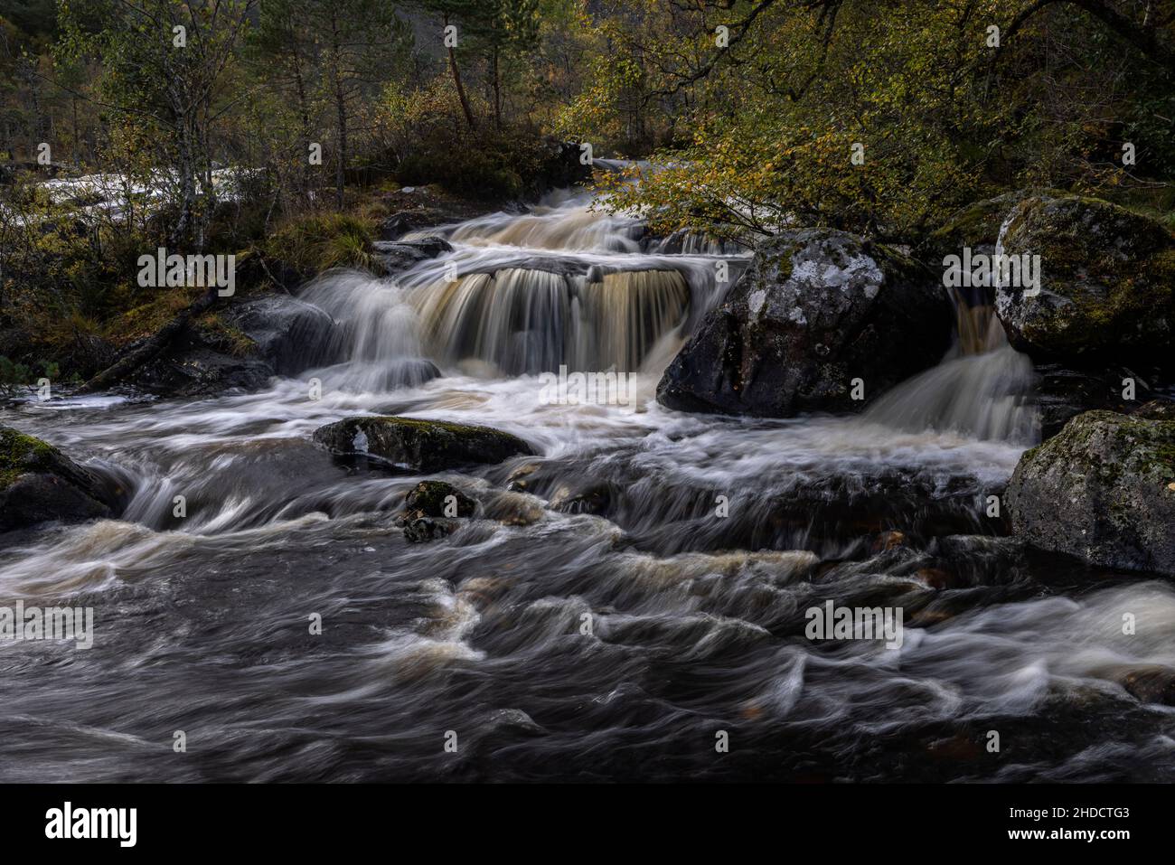 River Cannich in Autumn after heavy rain. Glen Cannich, Highland ...