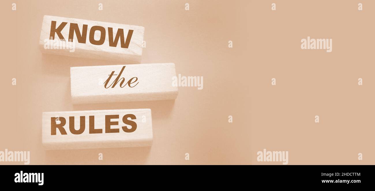 Know the rules word on wooden blocks isolated on dark grey background ...