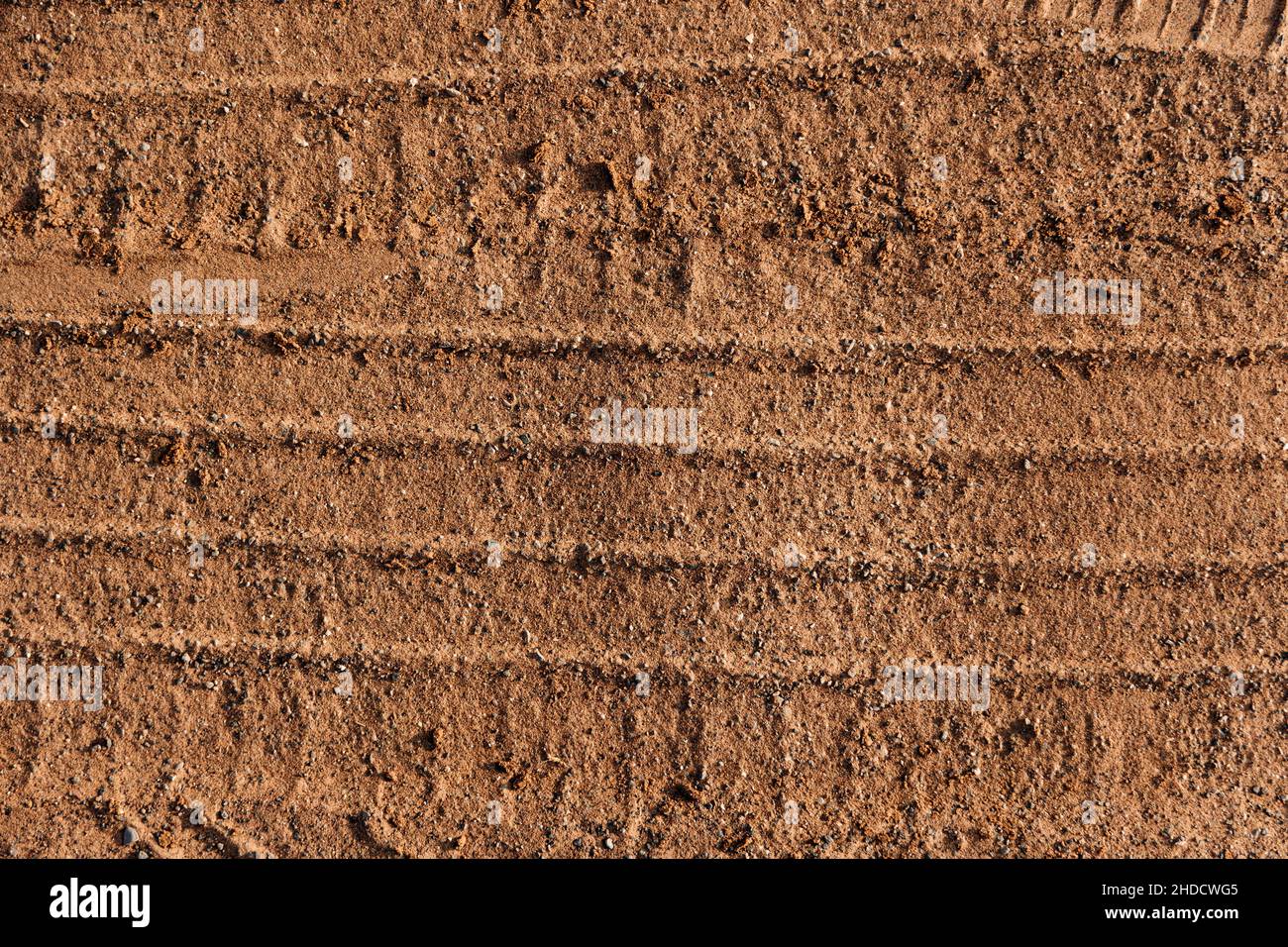 Car wheel tracks on dry sandy ground Stock Photo - Alamy