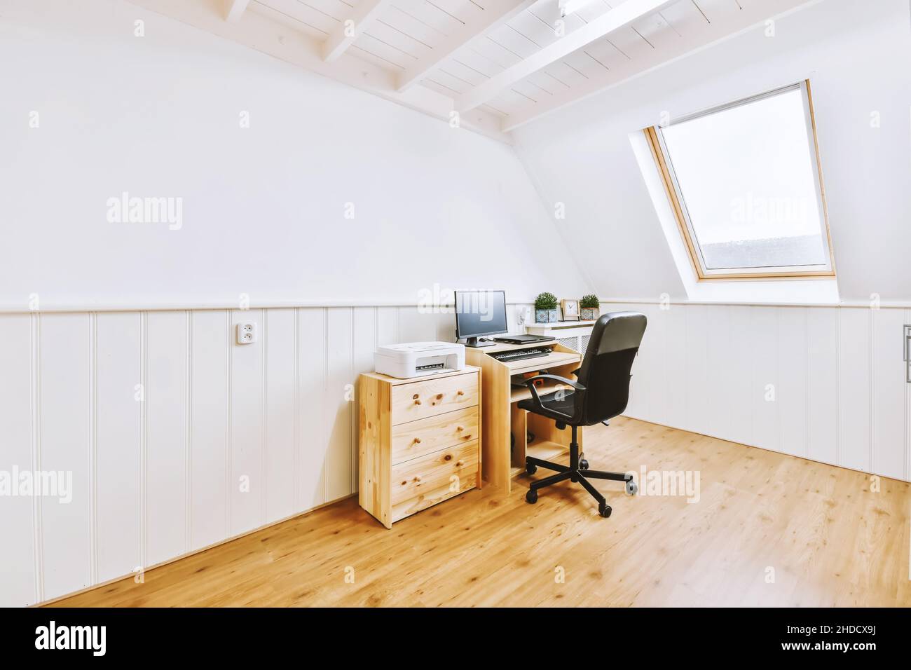 Interior of a modern workplace at home and white walls. window in the ...