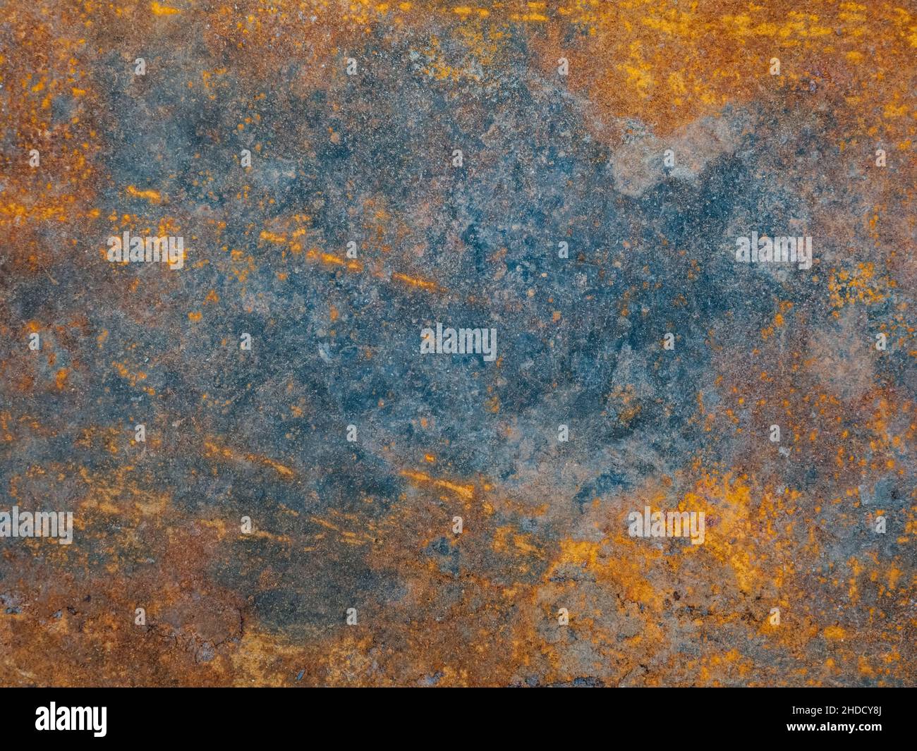 Metal plate with weathered colors and rust. Natural light. Blue and ...